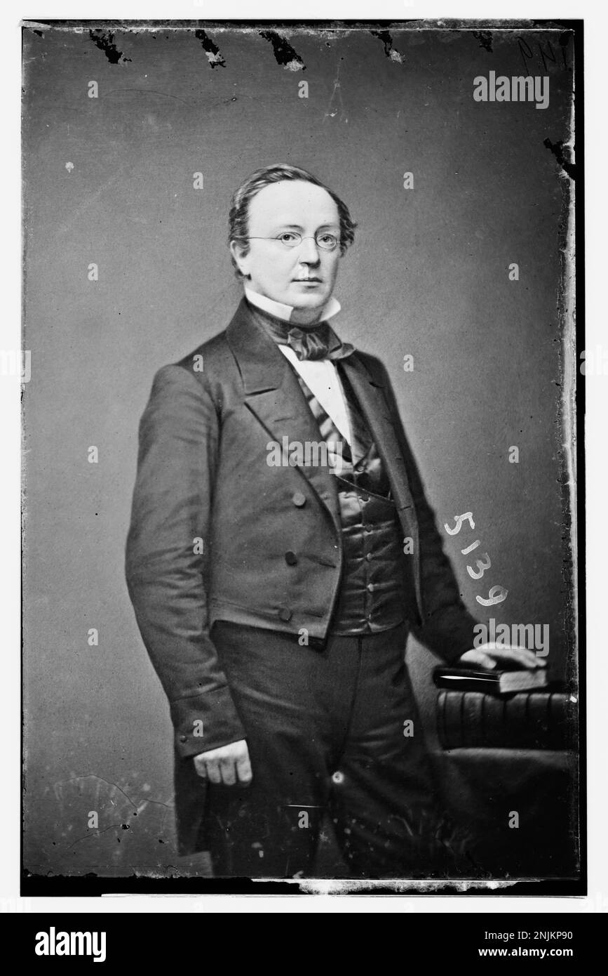 Rev. Clark, a 19th-century religious leader, captured in a formal ...