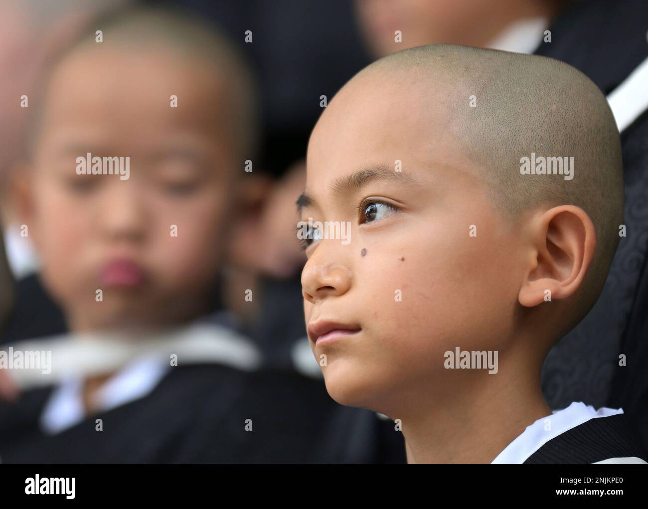 Elementary school students, who get their heads shaved, pose for a ...