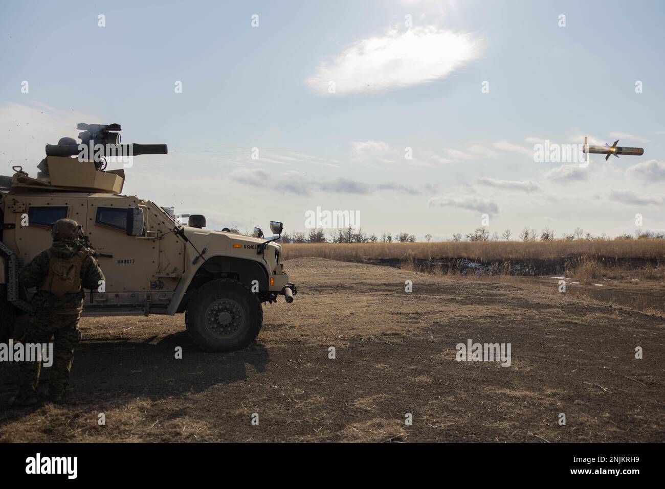 U.S. Marines with 3d Battalion, 4th Marines, fire a TOW missile system ...