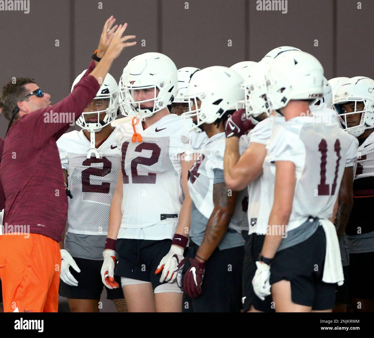 Virginia Tech coach Brent Pry talks to receivers during the NCAA ...