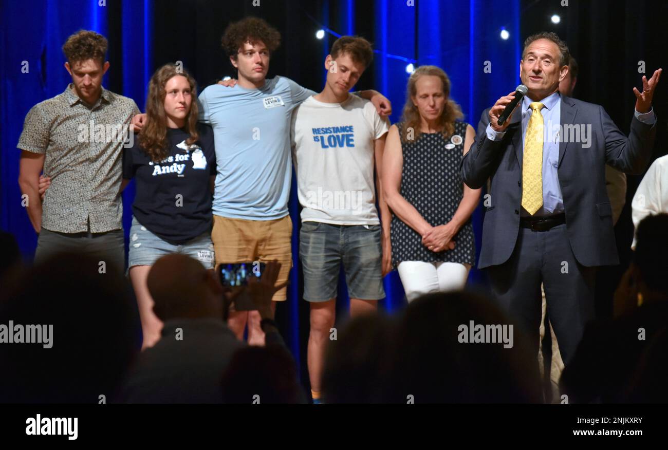 U.S. Rep. Andy Levin, right, addresses his supporters as his family ...