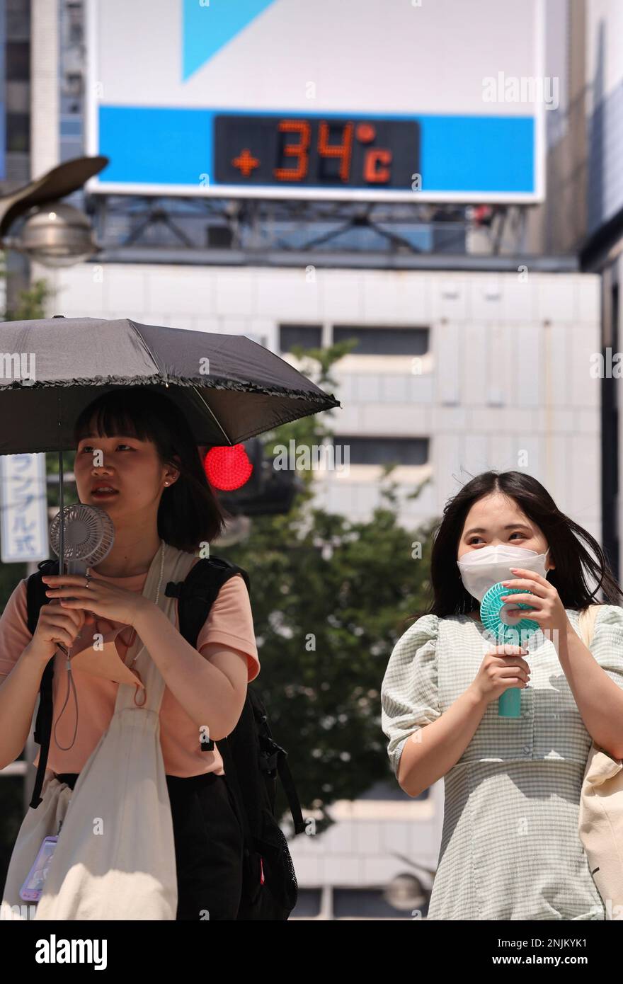 A thermometer shows the temperature near Shinjuku Station in Tokyo on ...