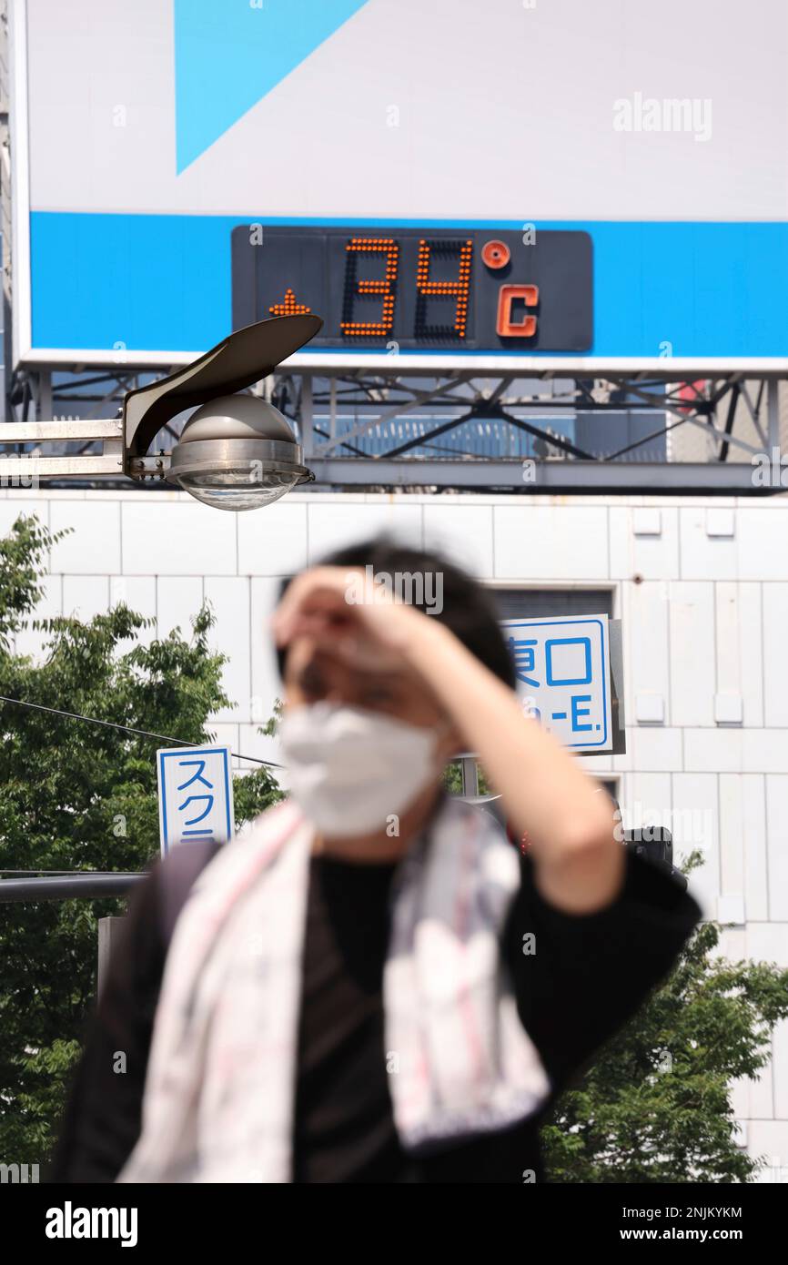 A thermometer shows the temperature near Shinjuku Station in Tokyo on ...
