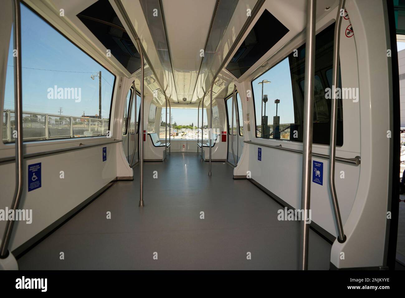 The interior of the new Automated People Mover (APM) train car is shown ...