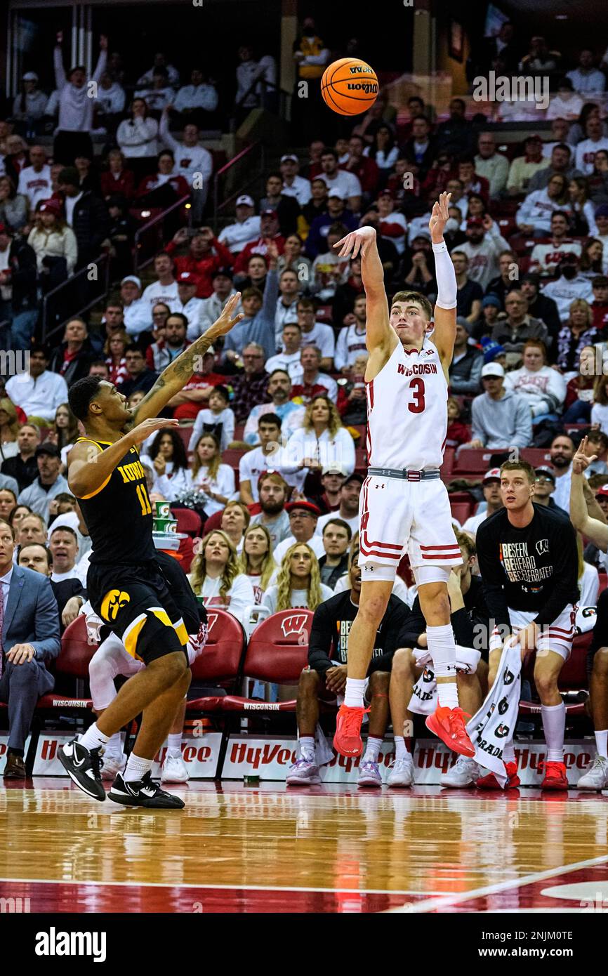 Wisconsin's Connor Essegian (3) shoots against Iowa's Tony Perkins (11 ...