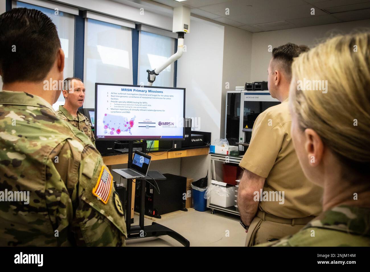 (From left to right) U.S. Army Col. Jason Bennett, the deputy director of infectious diseases at ...