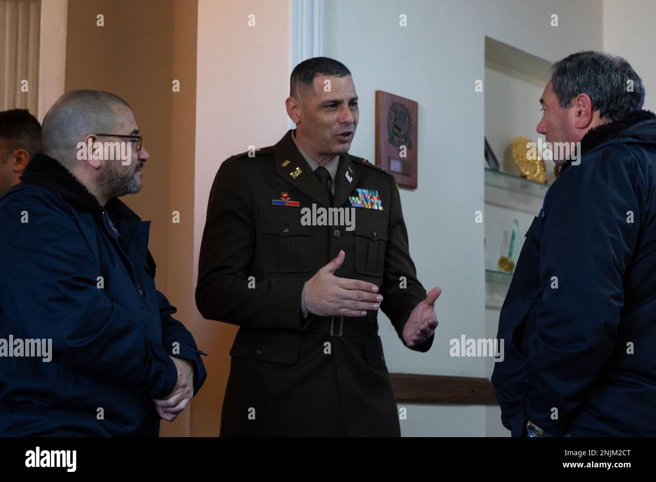 U.S. Army Cpt. Juan Torres Santiago, center, bilateral affairs officer ...