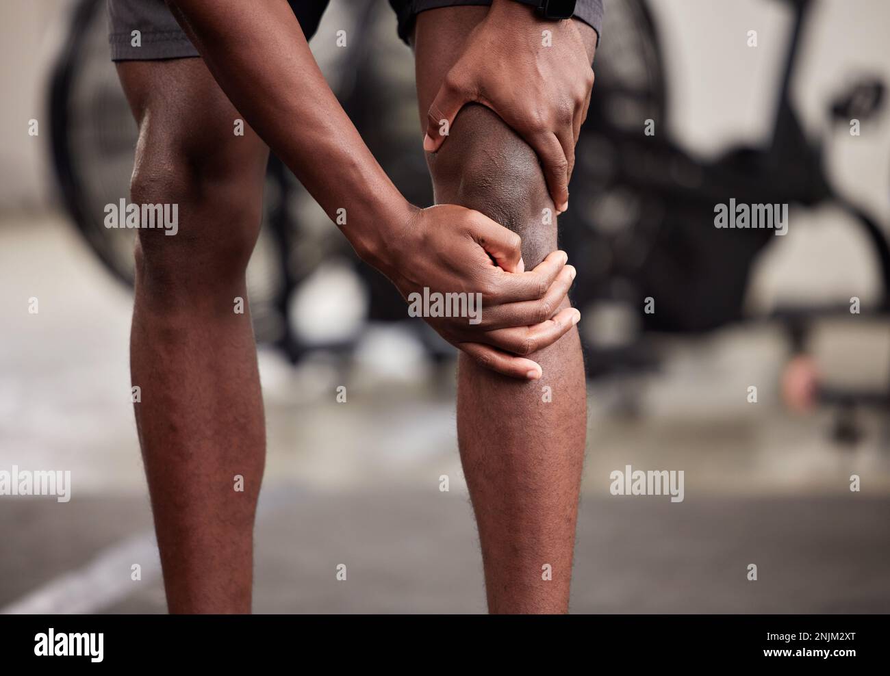 Knee pain, black man legs and gym fitness of a athlete with leg muscle ...