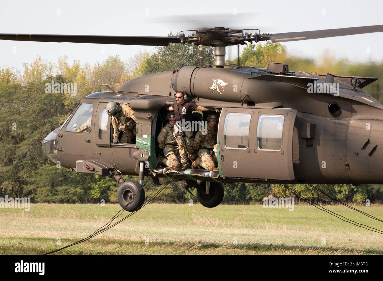 U.S. Army Air Assault cadre oversees rappel operations from a UH-60 ...