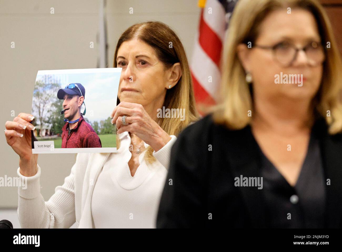 Linda Beigel Schulman holds a photograph of her son, Scott Beigel ...