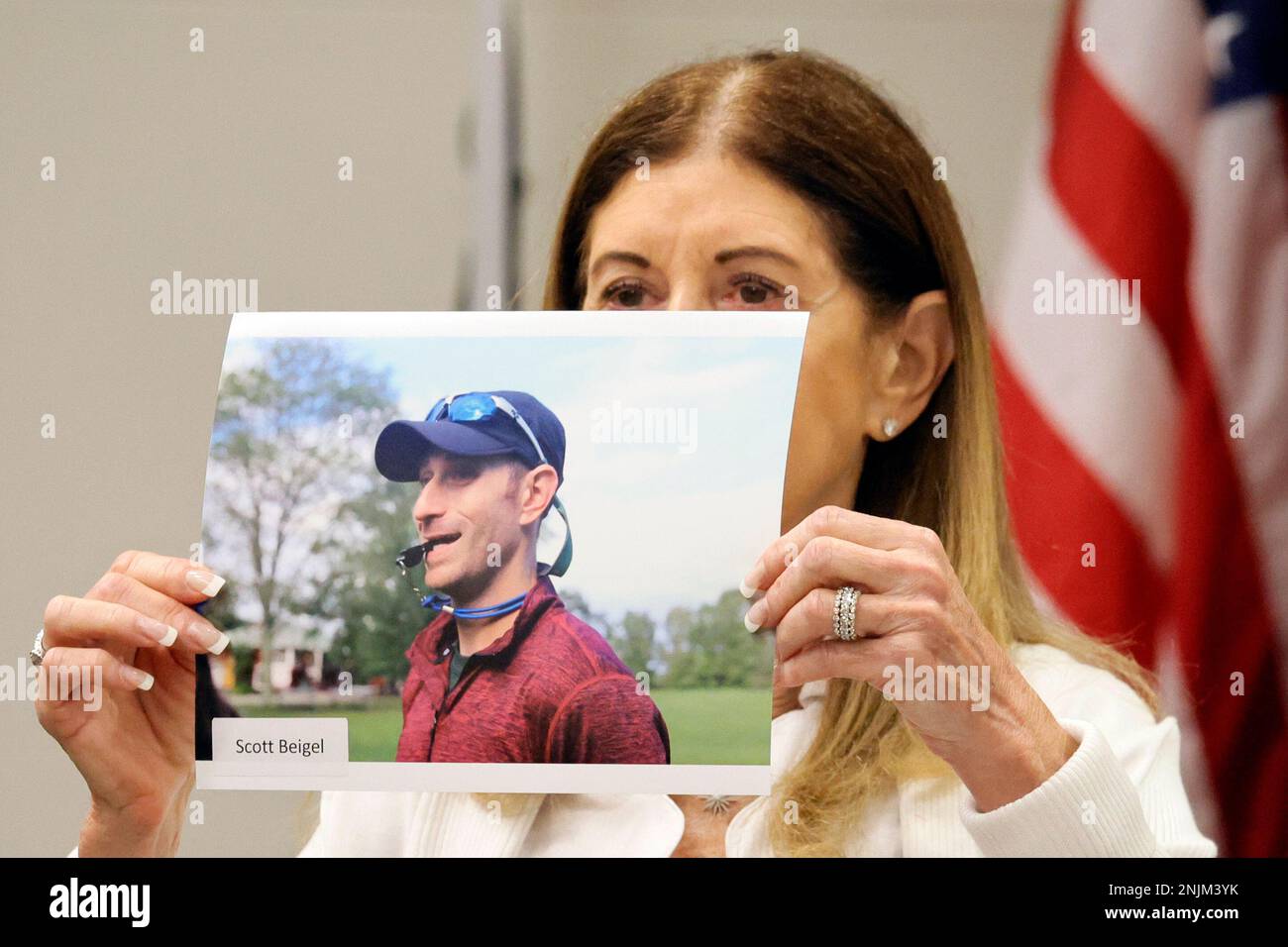 Linda Beigel Schulman holds a photograph of her son, Scott Beigel ...