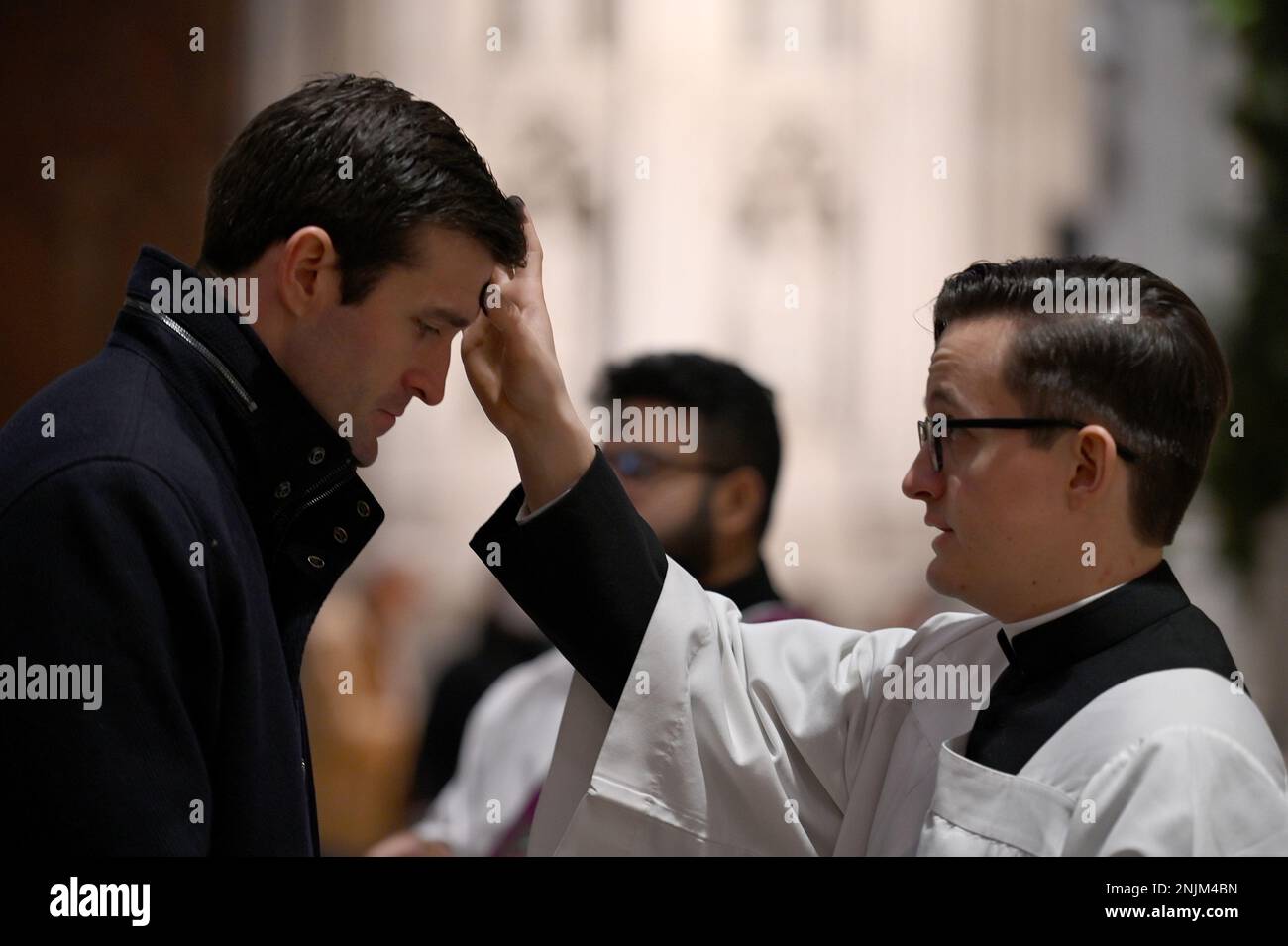 New York, USA. 22nd Feb, 2023. A man receives a cross of ash on their ...