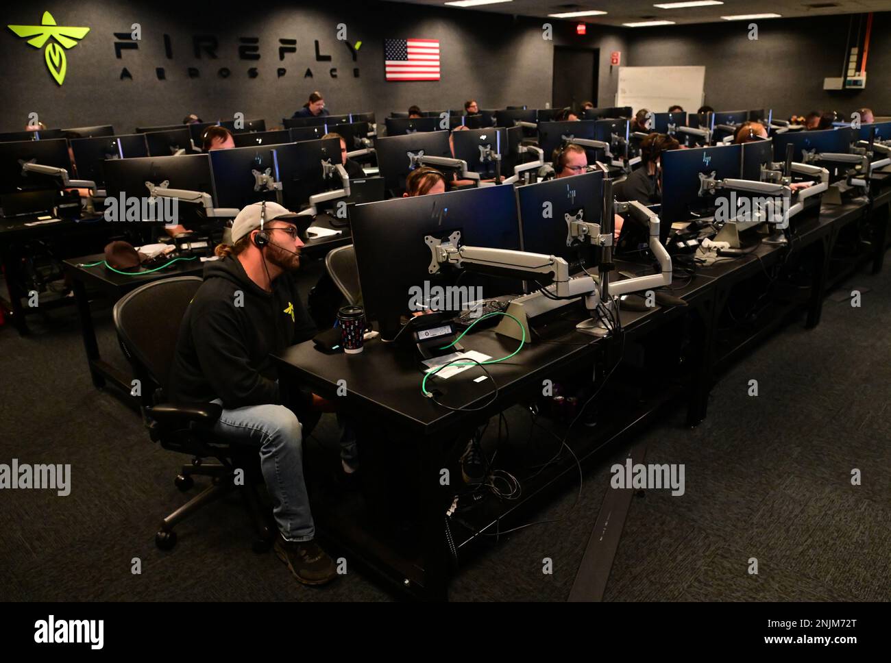 Firefly Aerospace employees monitors computer data in preparation for a ...