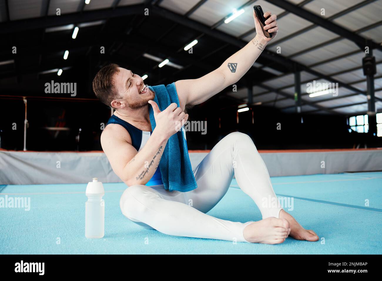 Man, gymnast and thumbs up for fitness selfie, profile picture or vlog ...