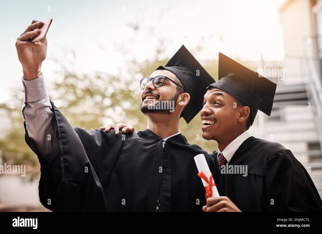 Graduation day for these buddies. students taking a selfie on ...