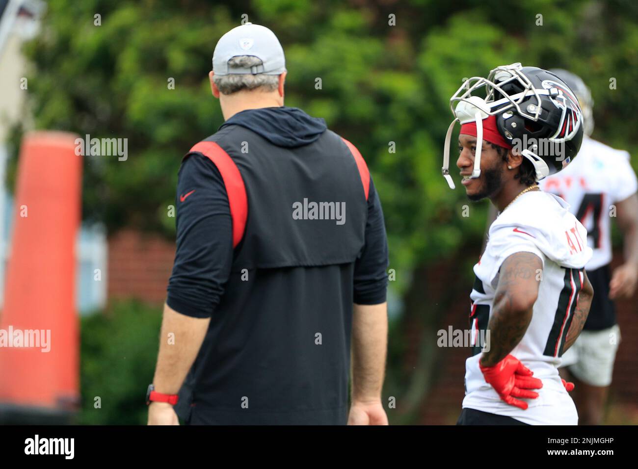 FLOWERY BRANCH, GA - JULY 30: Falcons head coach Arthur Smith confers ...