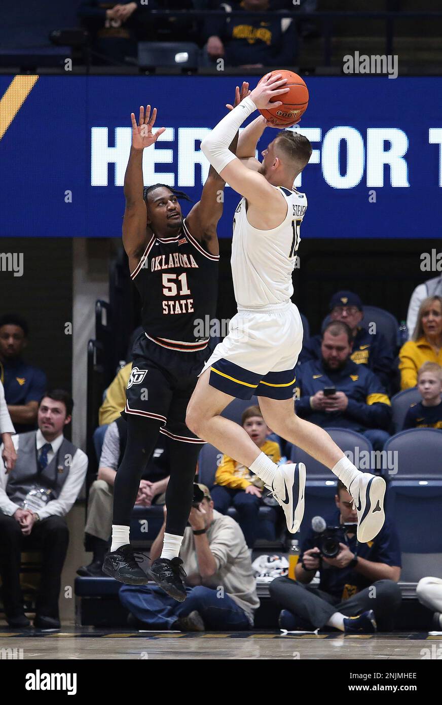 West Virginia guard Erik Stevenson (10) is defended by Oklahoma State ...