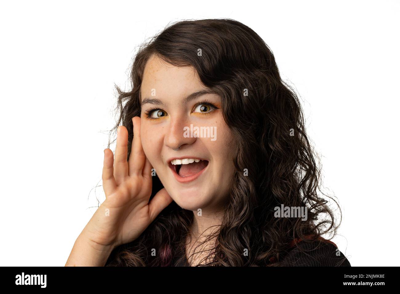 Young woman happy and surprised, on white background Stock Photo - Alamy