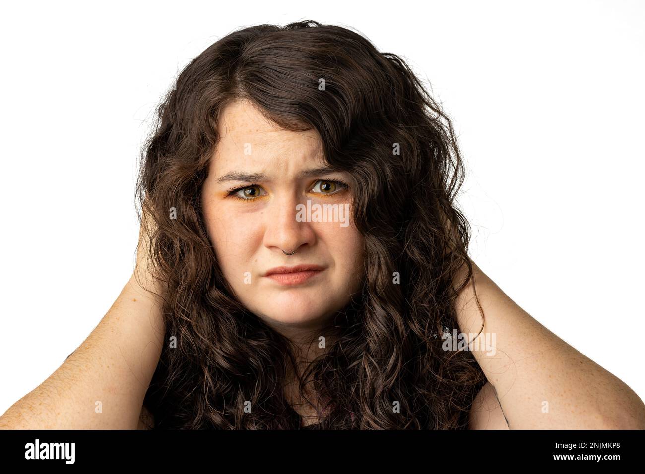 Close up portrait of worried young woman on white background Stock ...