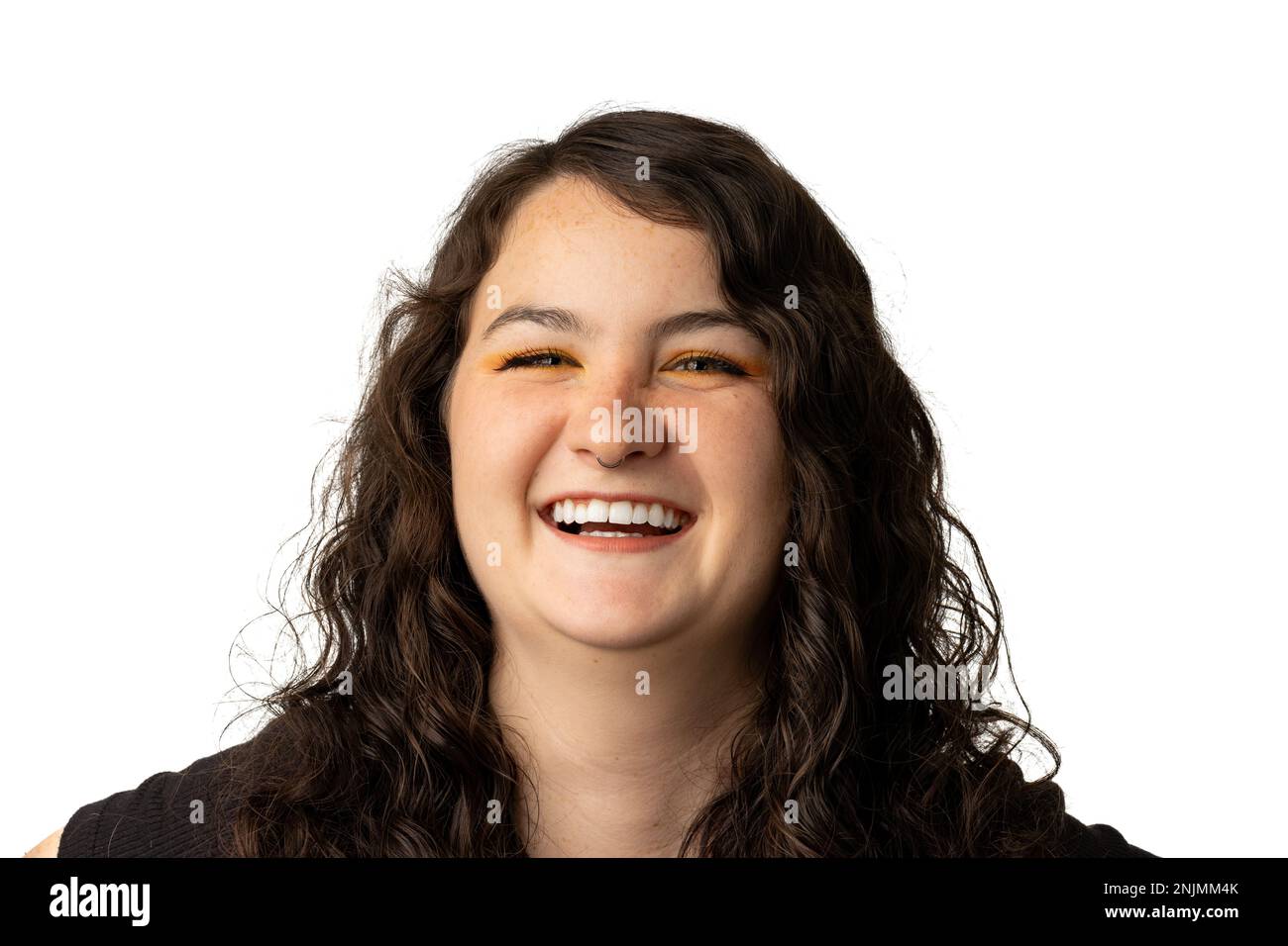 Young woman laughing at the camera, isolated on white background Stock ...
