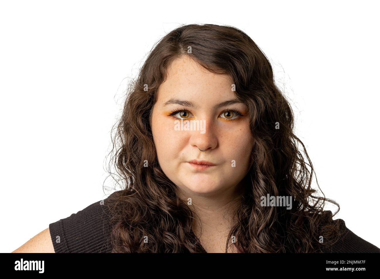 Portrait of young woman who is has a questioning look, on white ...