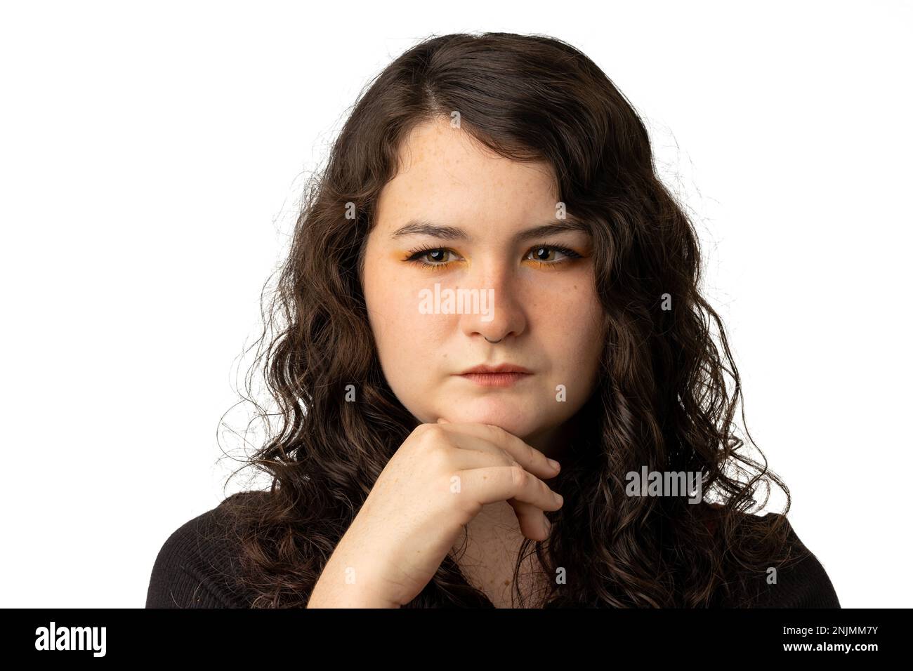 Young woman deep in thought isolated on white background Stock Photo ...