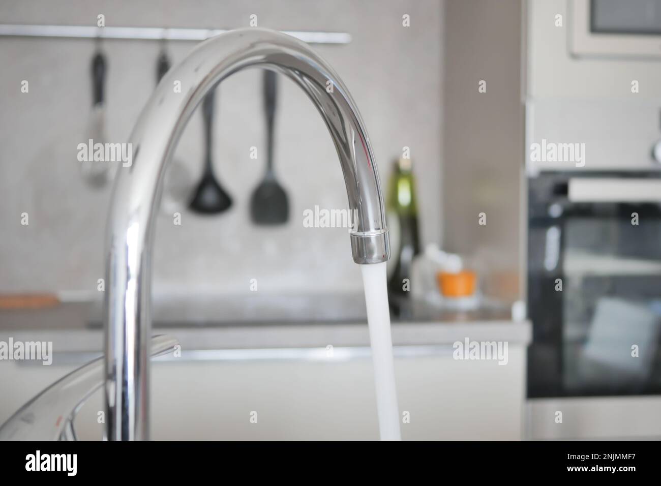 water pouring from a faucet tap slow motion Stock Photo - Alamy