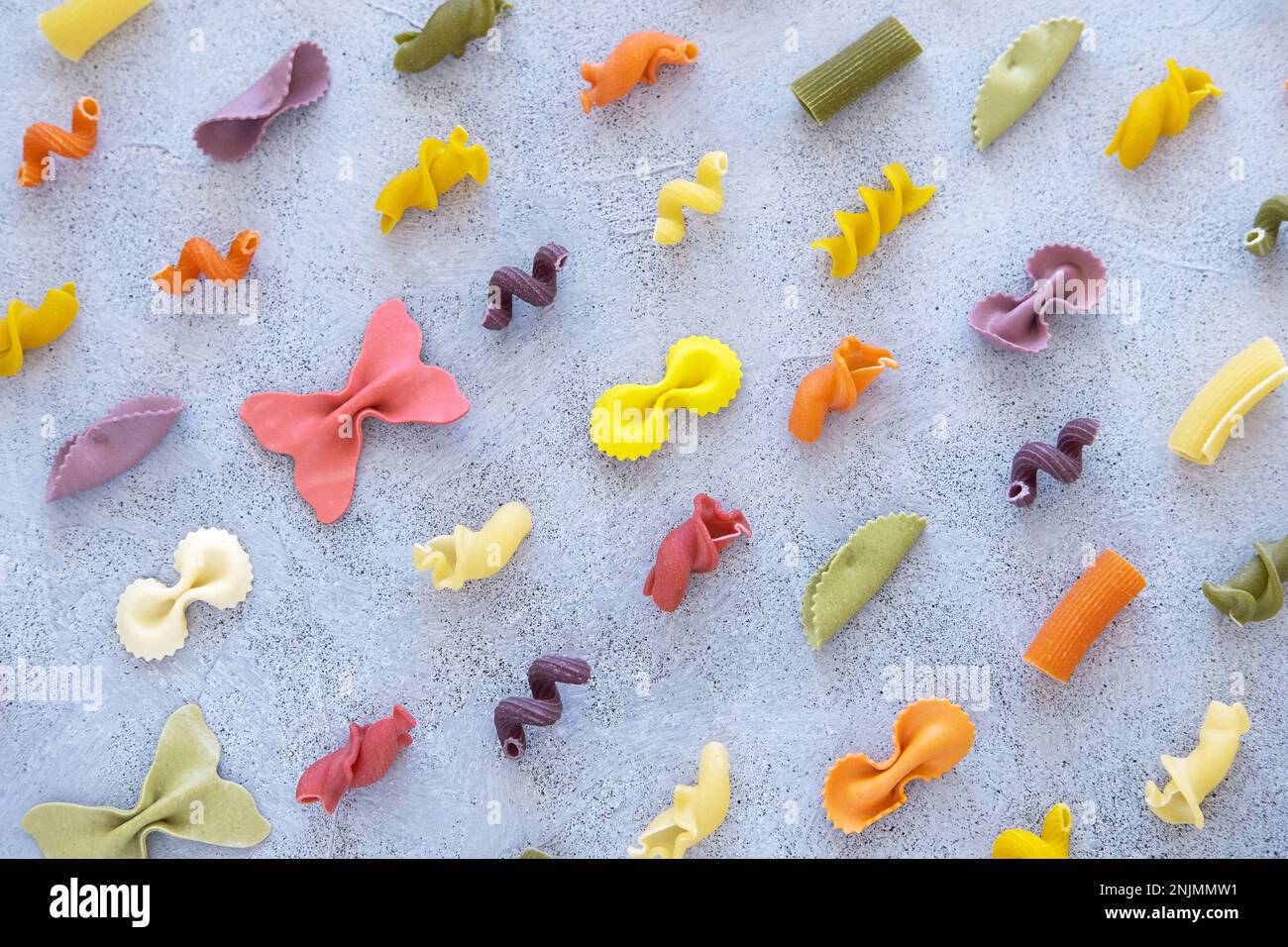 Pattern. Variety of types and shapes of Italian pasta on concrete ...