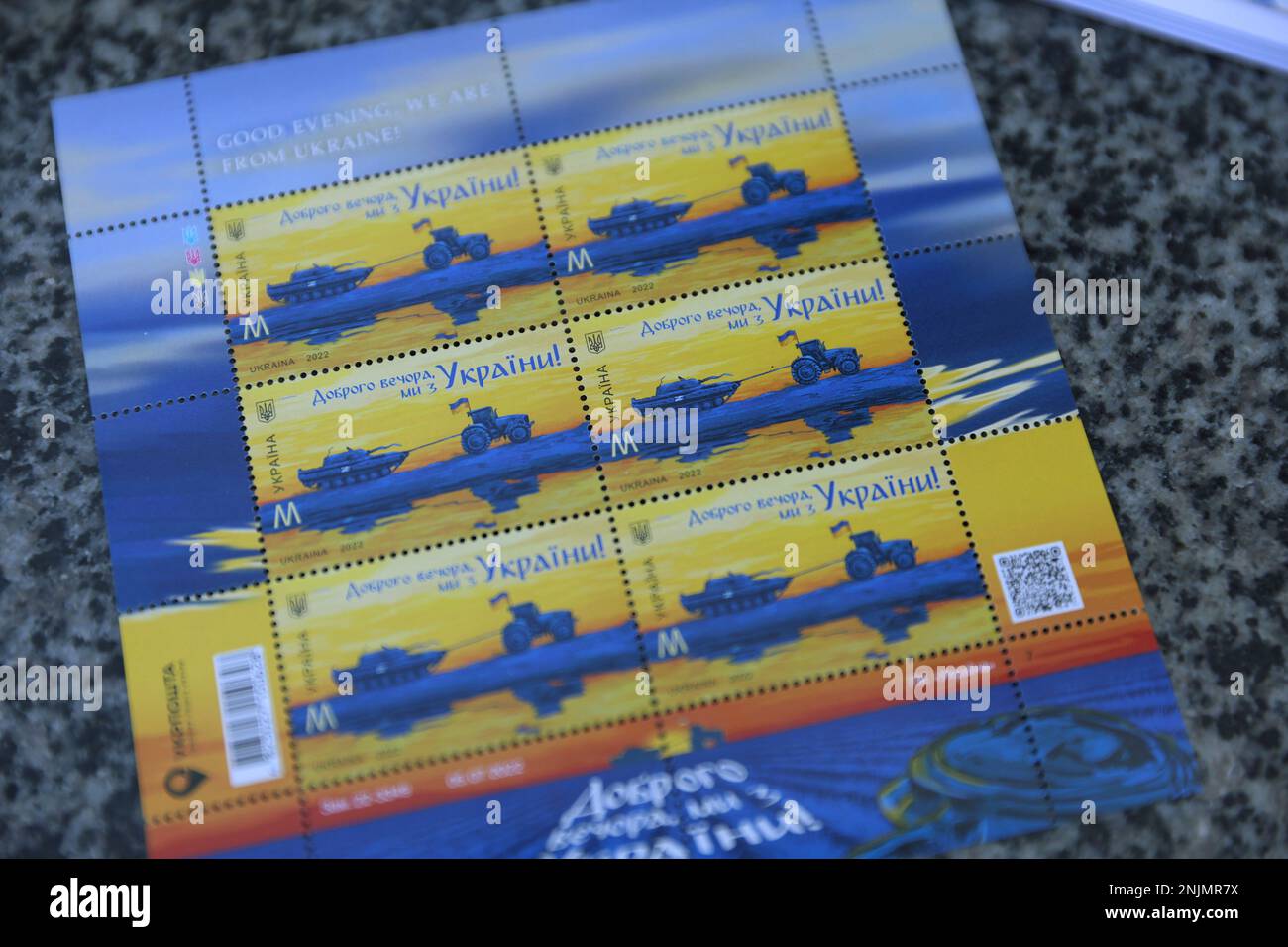 The postage stamp with a picture of a Ukrainian tractor pulling a ...