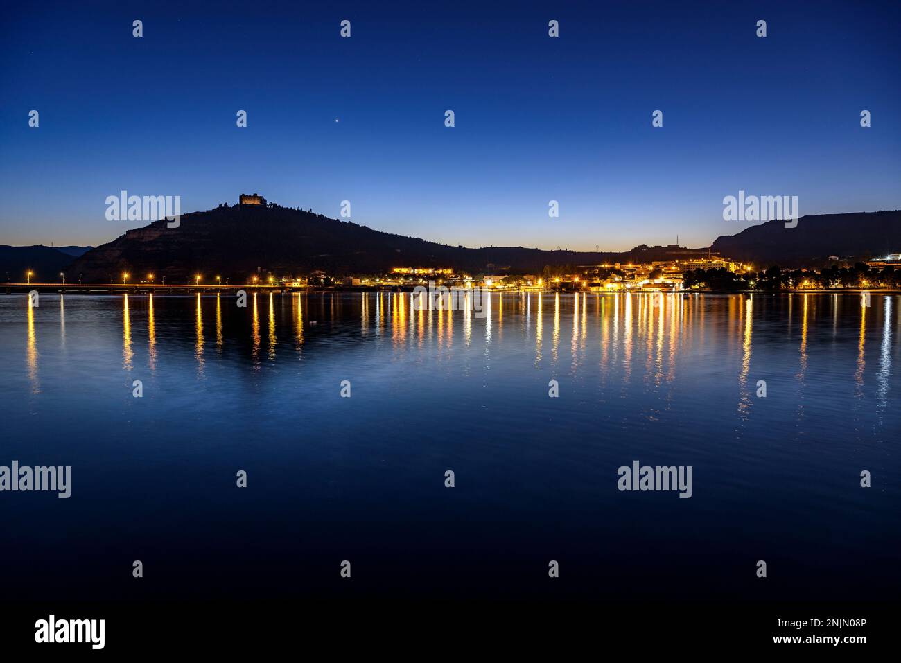 Mequinenza town and castle in the blue hour and at night, with the ...