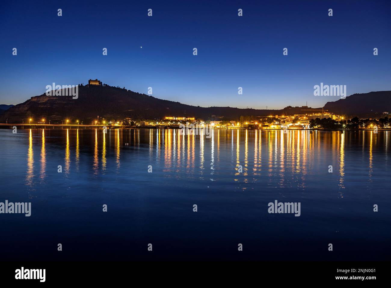 Mequinenza town and castle in the blue hour and at night, with the ...