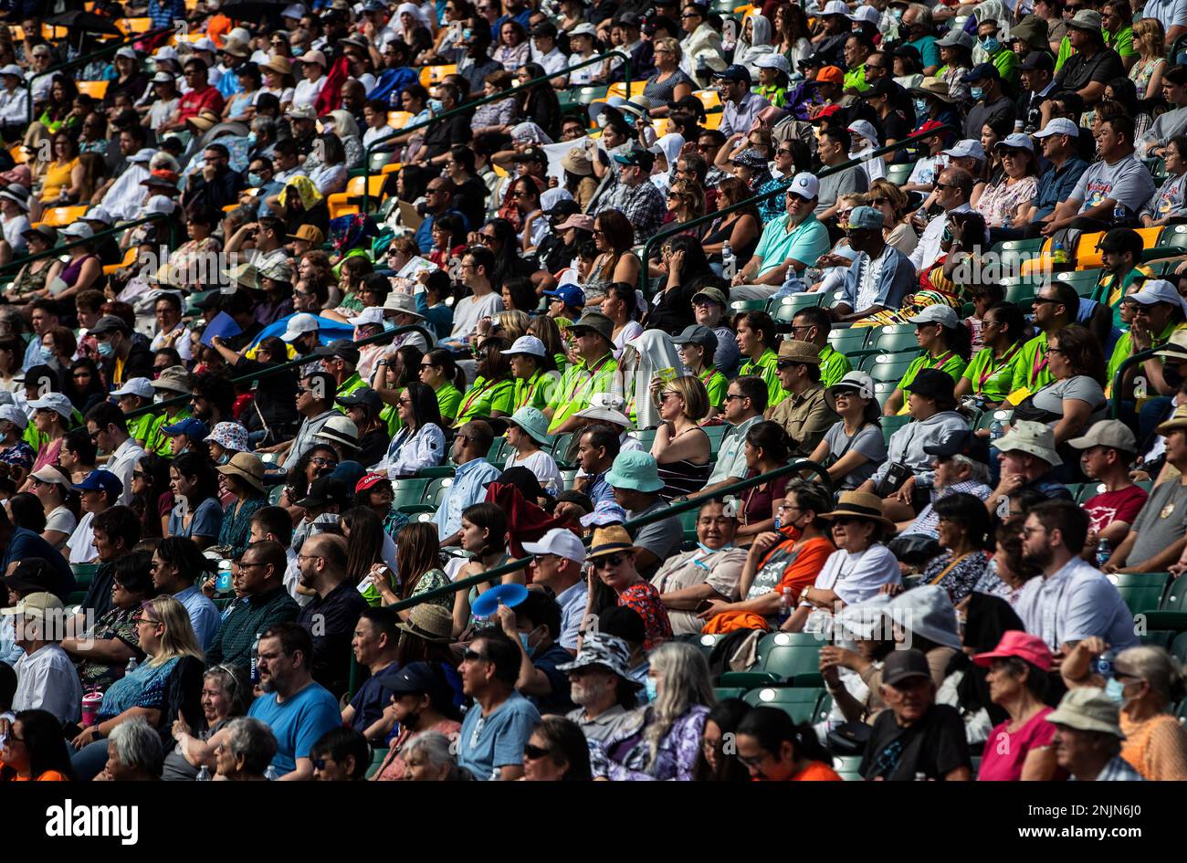 Members of the crowd watch as Pope Francis celebrates mass in Edmonton ...