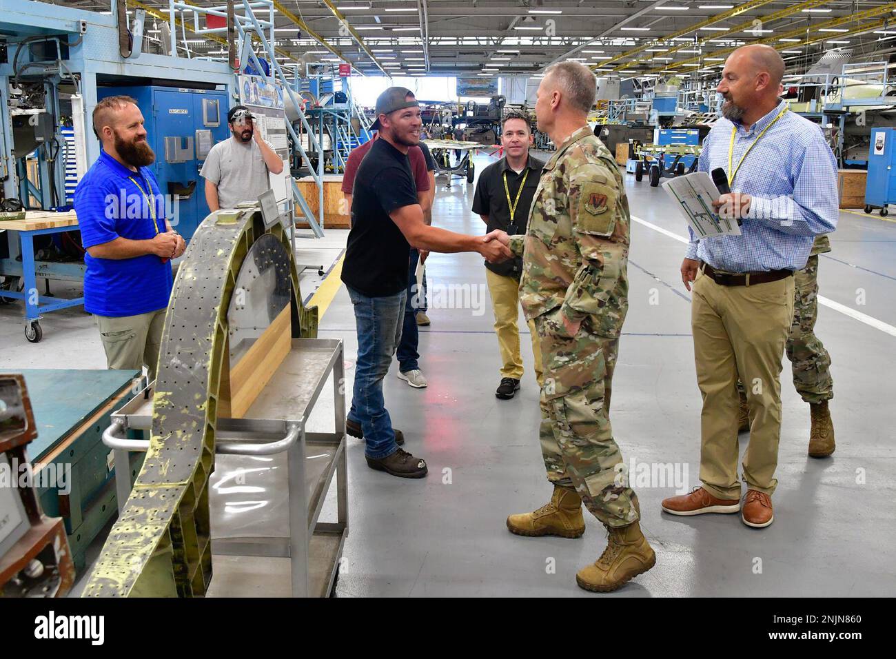 Dwain Martinson, 573rd Aircraft Maintenance Squadron, shakes hands with ...