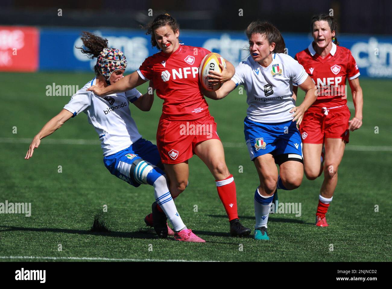 Team Canada's Sabrina Poulin, second from left, pushes away Team Italy ...