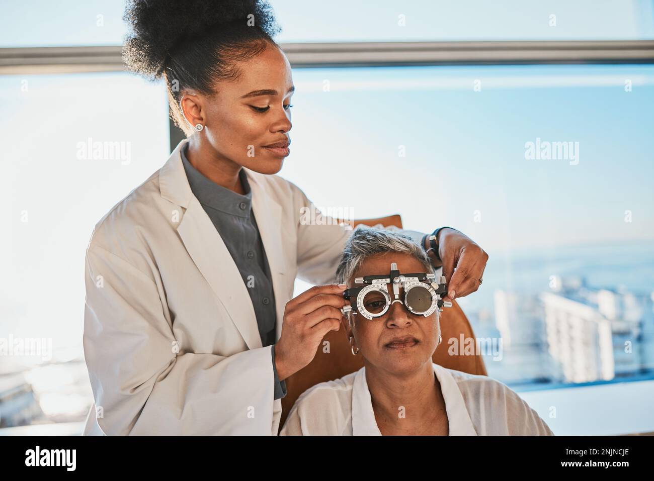 Senior black woman, eye exam and medical test of elderly client at ...