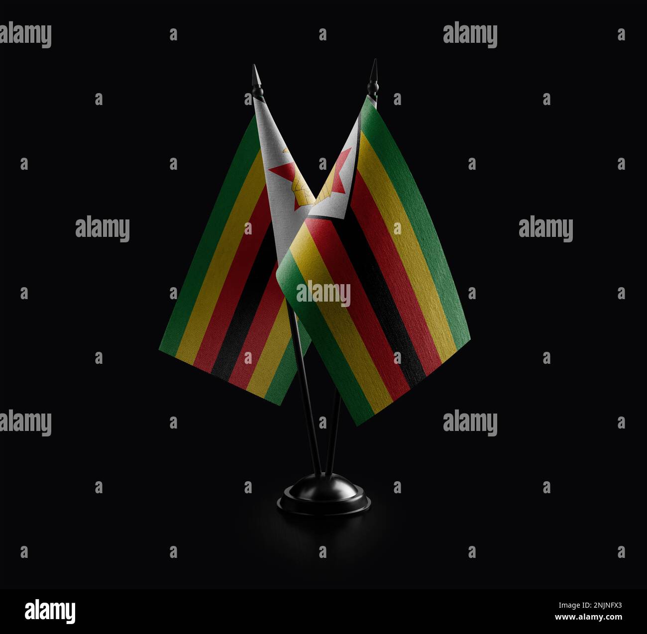 Small national flags of the Zimbabwe on a black background Stock Photo ...