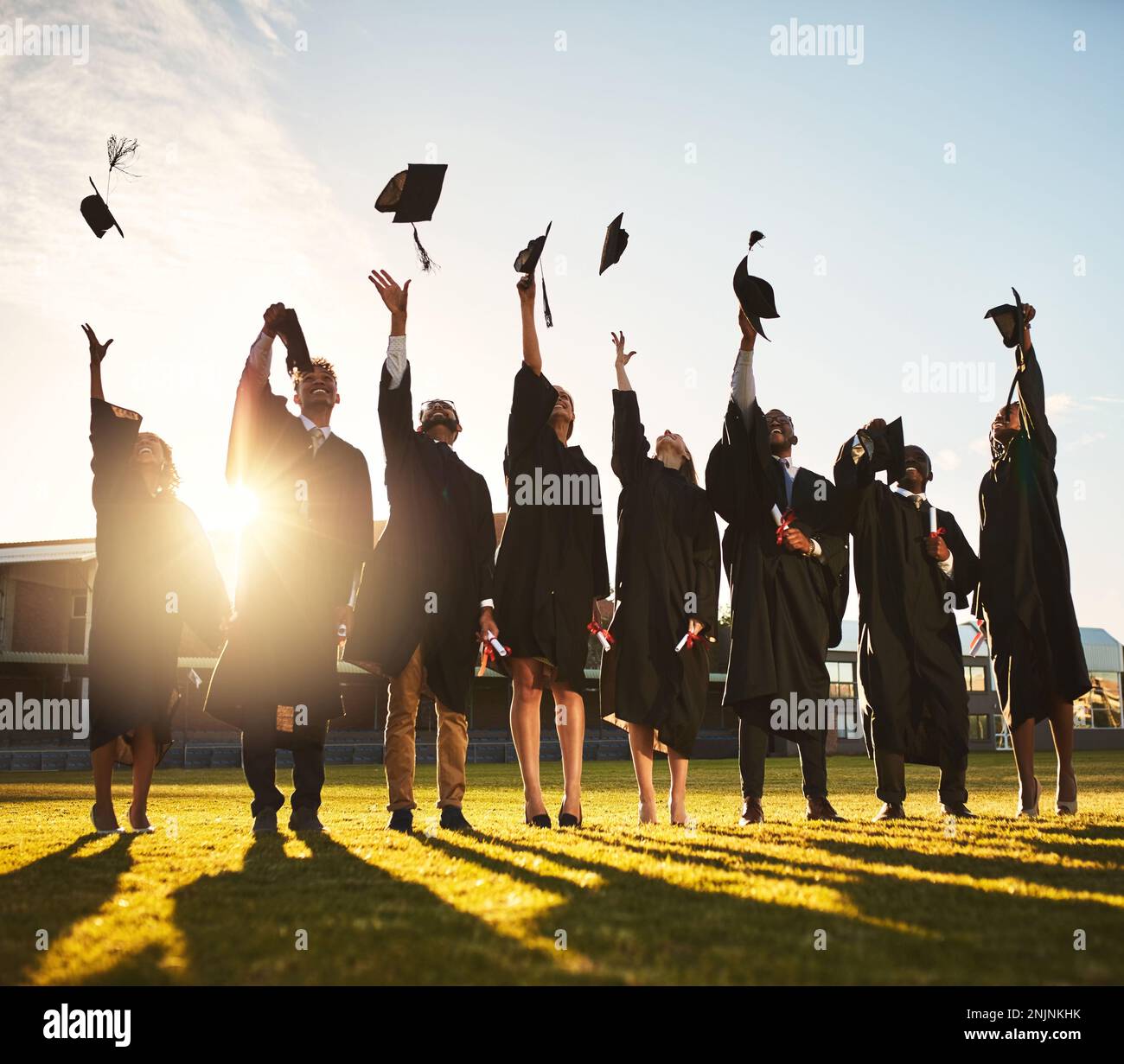 Our work here is done. a group of smiling university students cheering ...