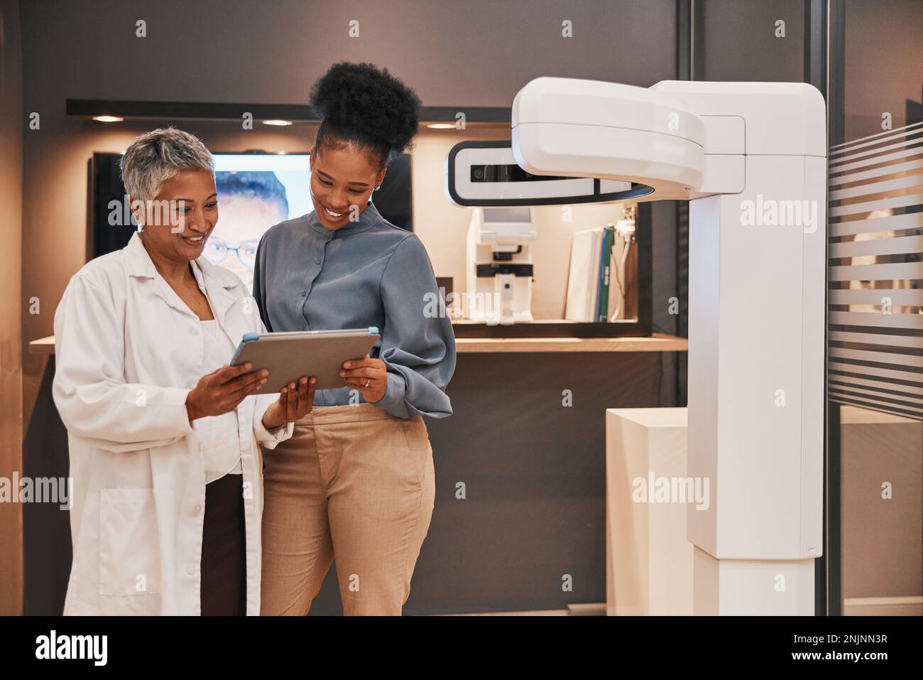 Ophthalmology, healthcare and teamwork with people and tablet in clinic ...