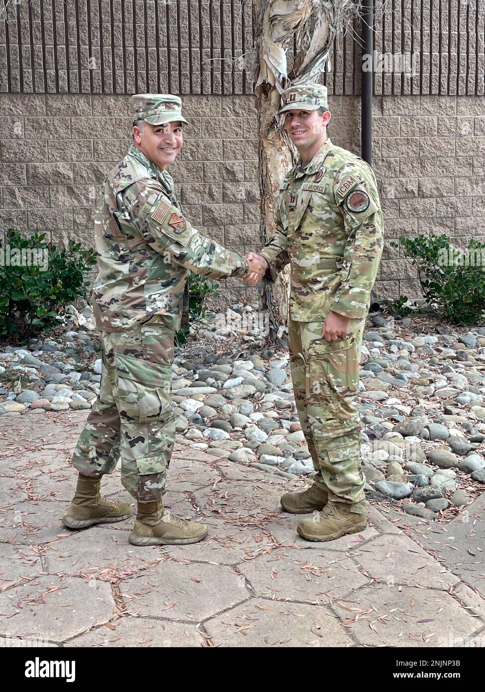 Col. Jason Vattioni, 377th Air Base Wing commander, coins Capt. Scott ...