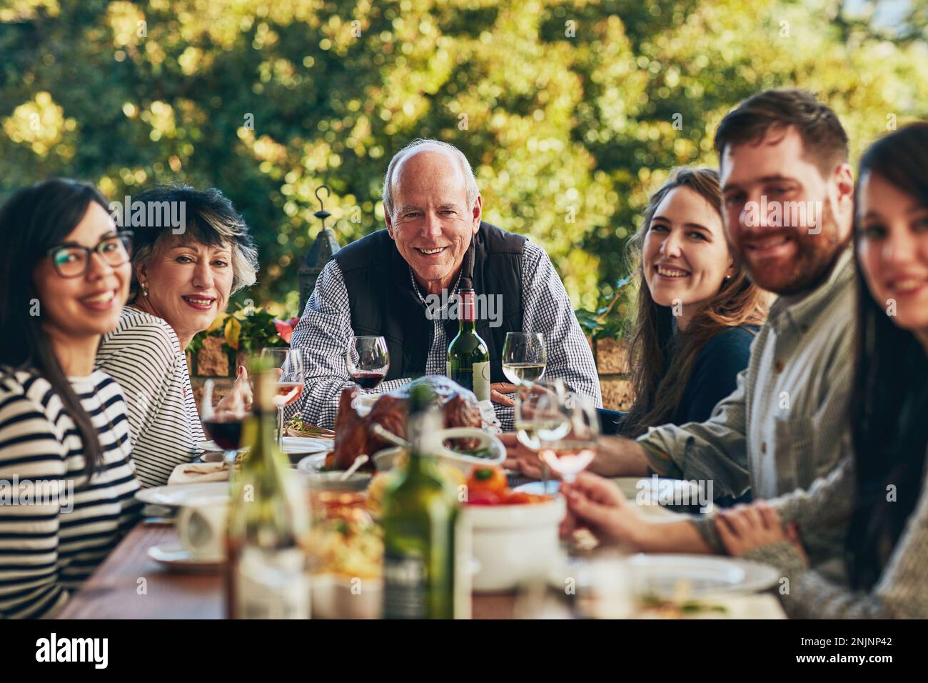 Im a happy man when I have my family around. a group of people sitting ...