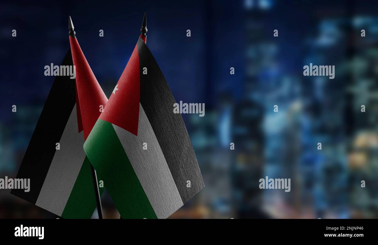 Small flags of the Jordan on an abstract blurry background Stock Photo ...