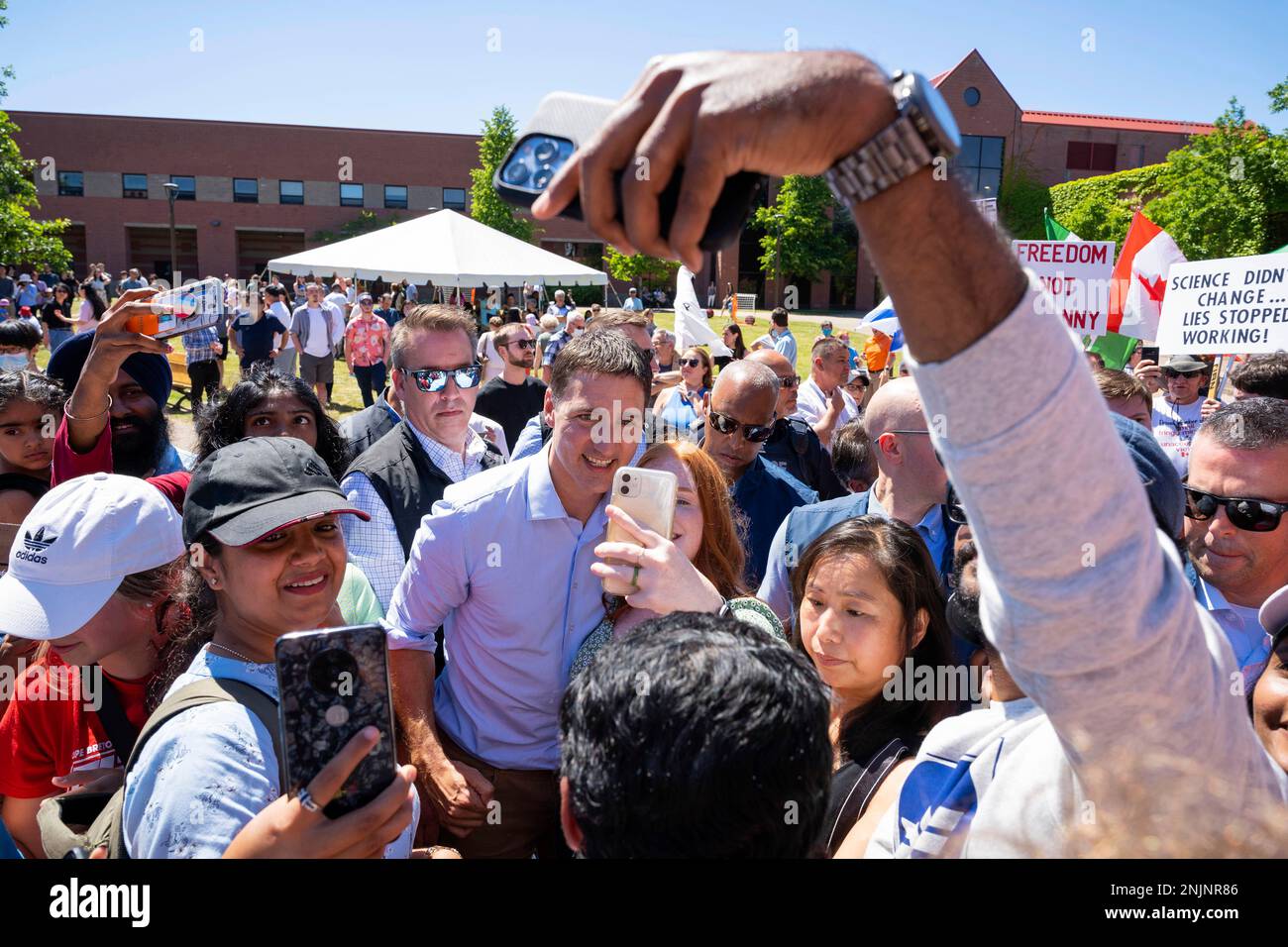 Canadian Prime Minister Justin Trudeau poses for a photo with attendees ...