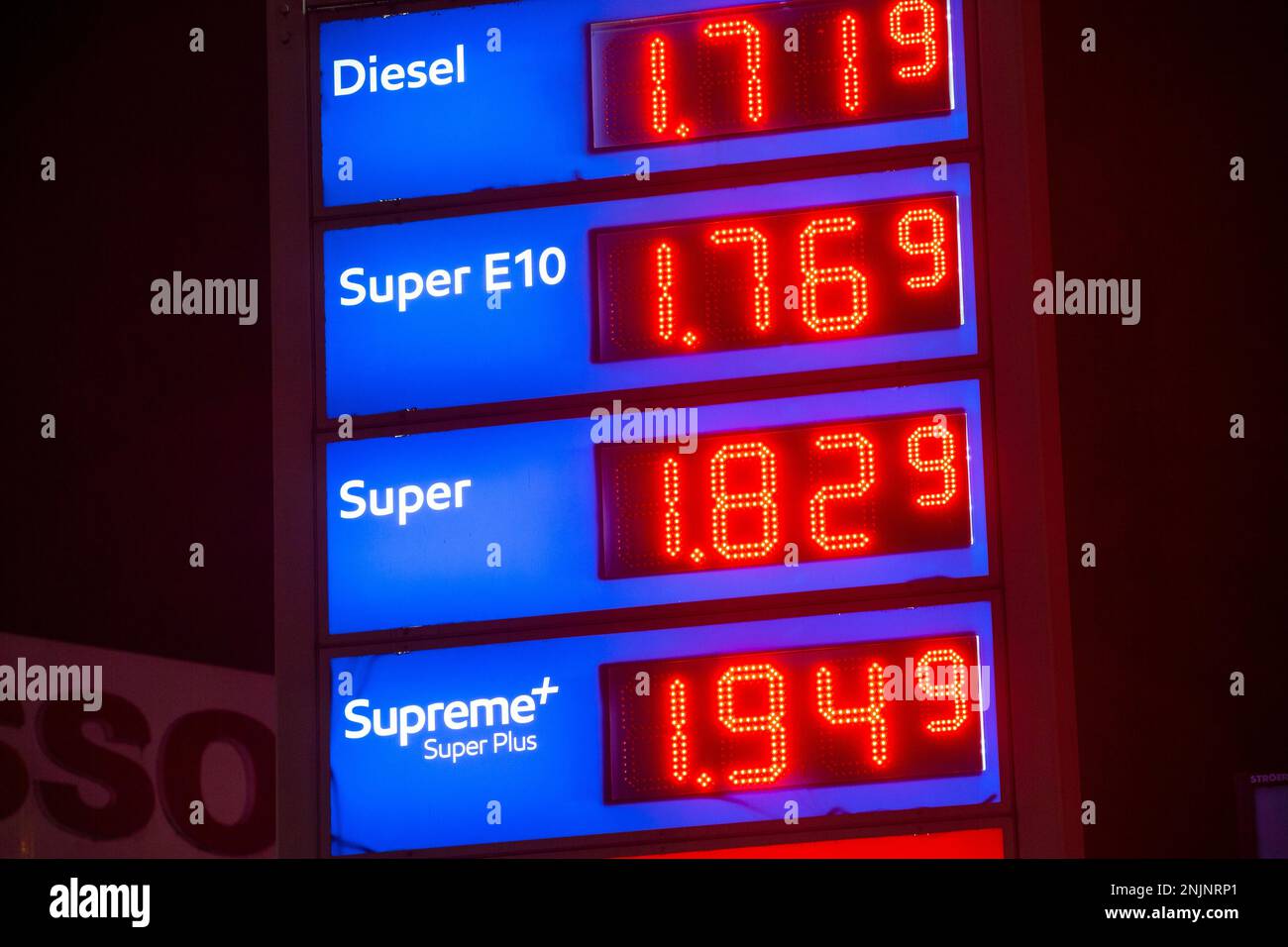 Cologne, Germany. 23rd Feb, 2023. Illuminated signs show the prices for ...
