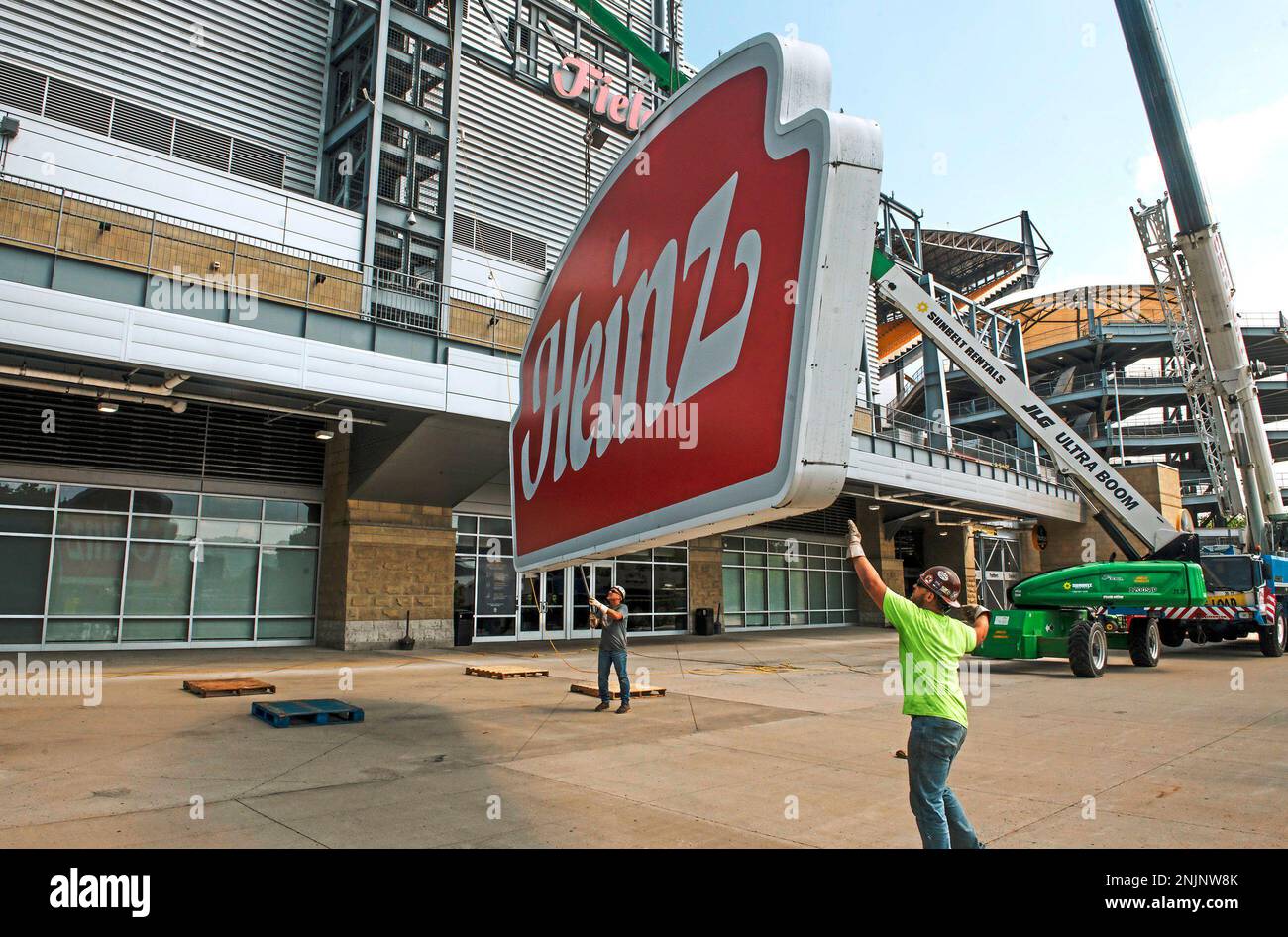 Evan Huebner, front, Eddie Gusten, rear, help remove Heinz Field ...