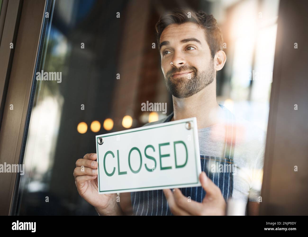 Well be back again though...a handsome young man hanging up a closed ...