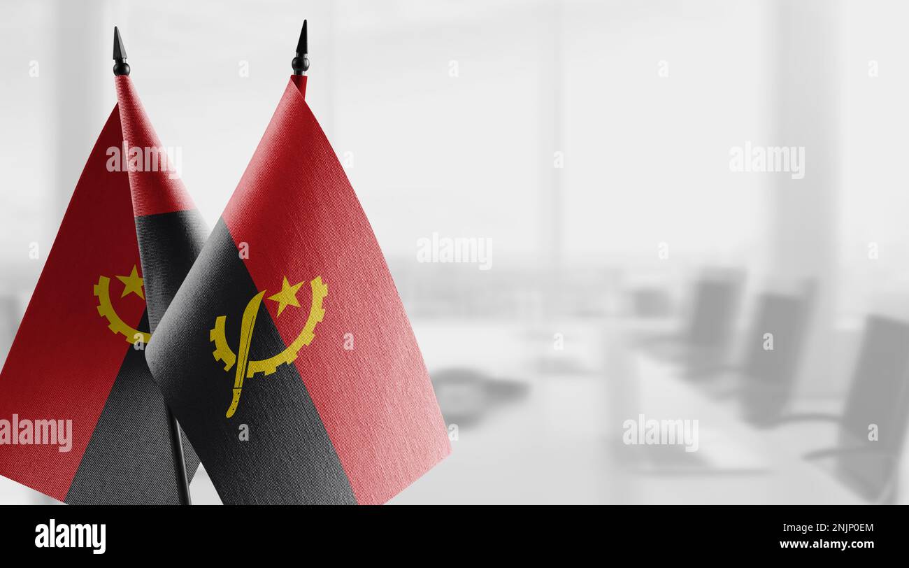 A small Angola flag on an abstract blurry background Stock Photo - Alamy