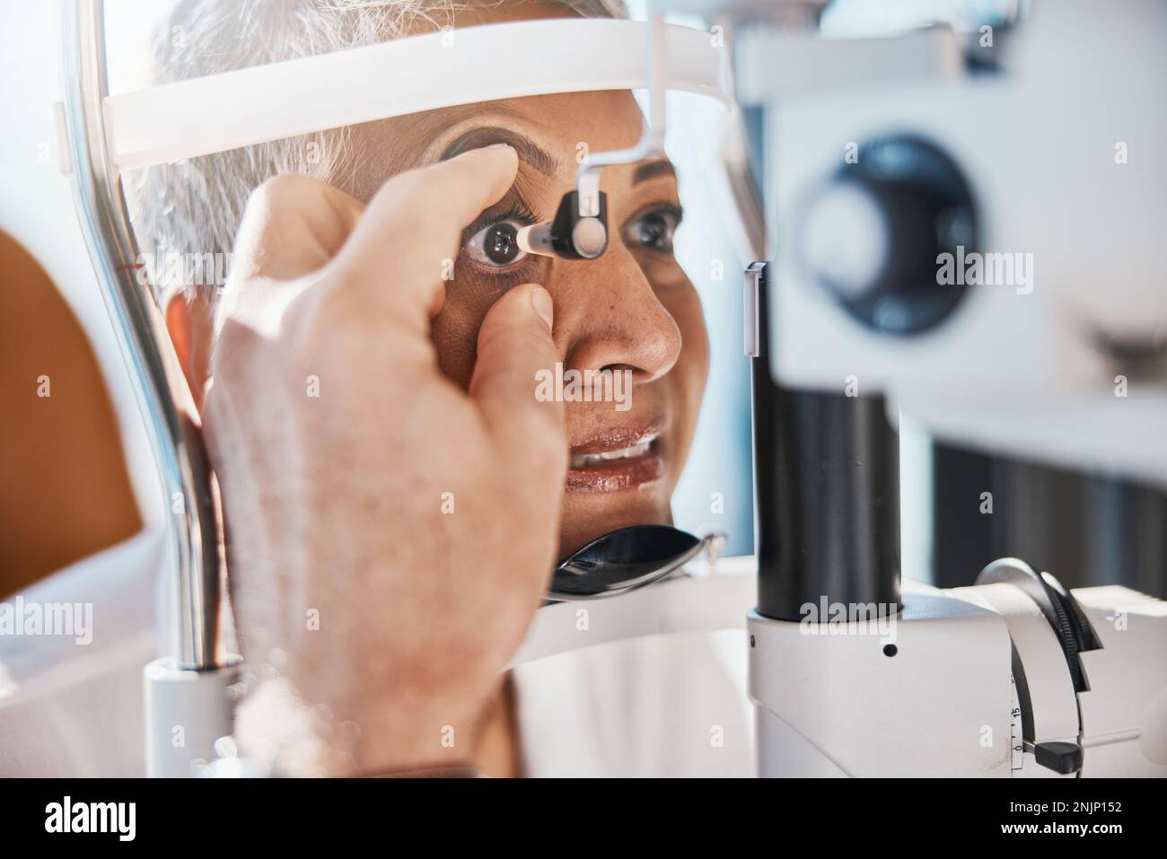 Senior eye zoom, retina check and medical eyes test of elderly woman at ...