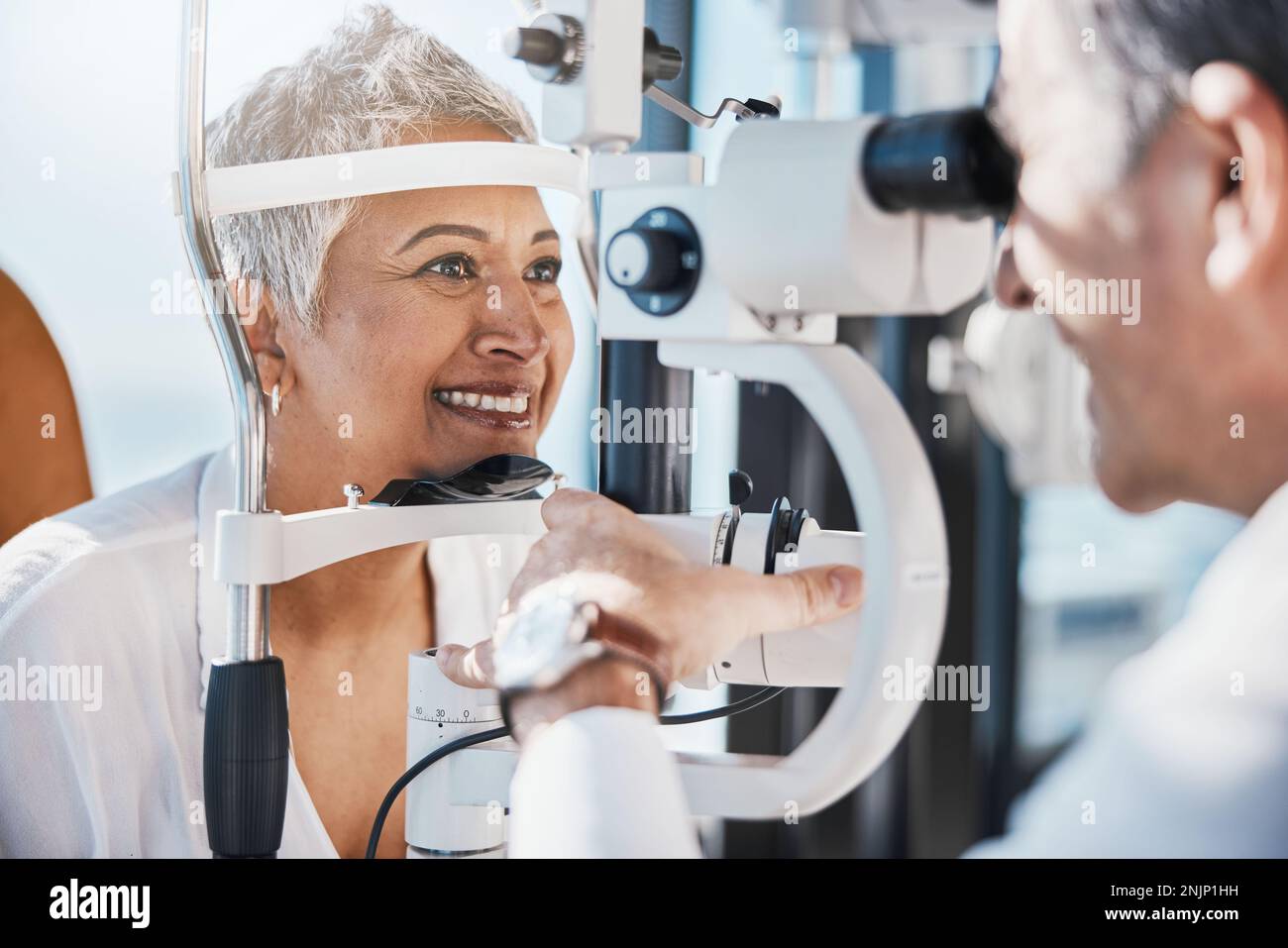 Senior woman, eye exam and optometrist with medical eyes test at doctor ...