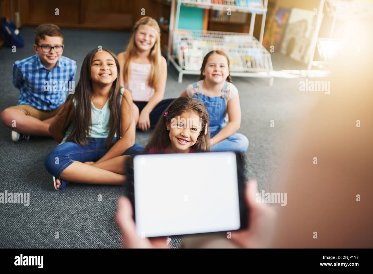 First one to answer is the winner. a group of young children having a ...