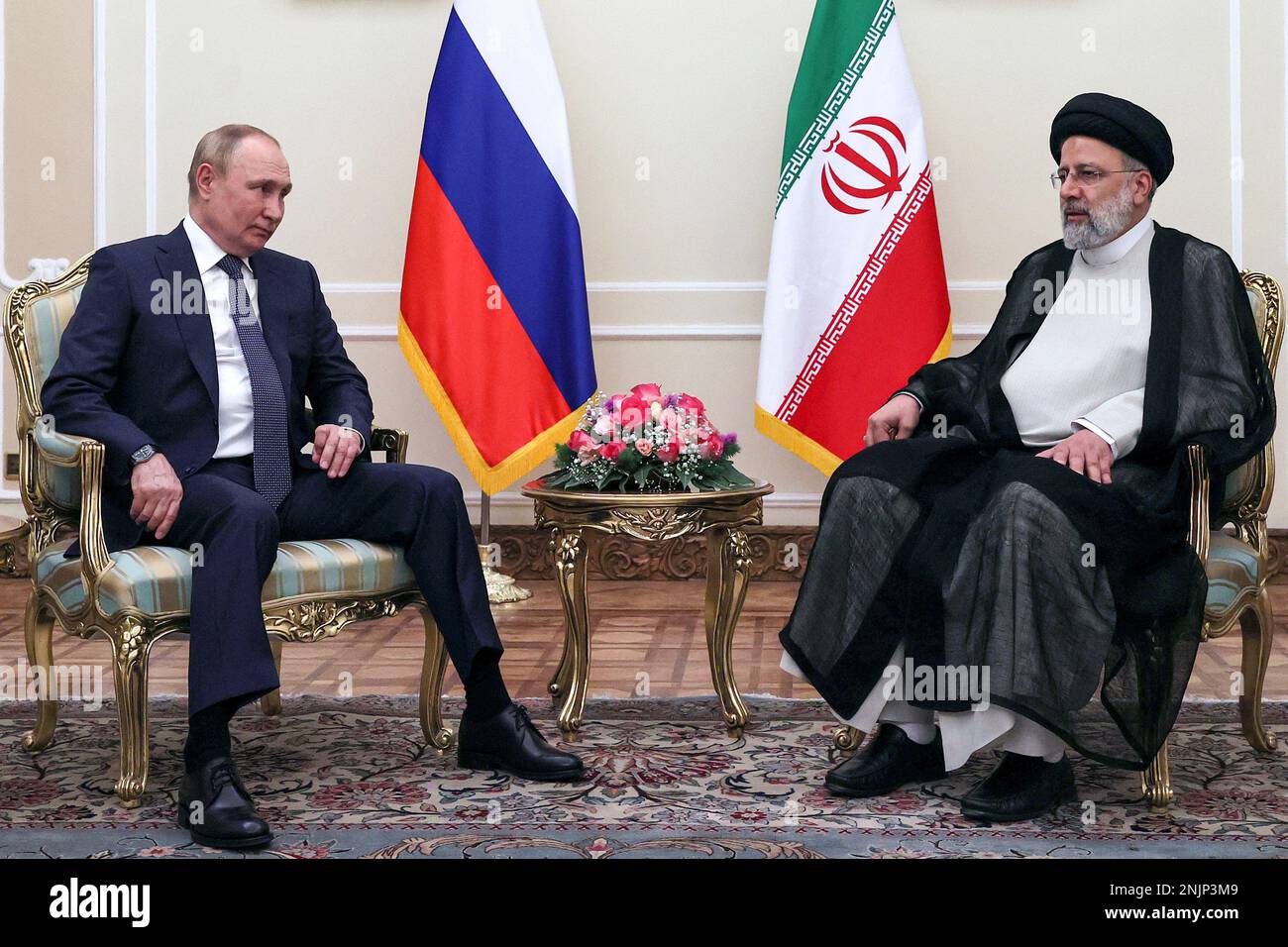Russian President Vladimir Putin, left, and Iranian President Ebrahim ...